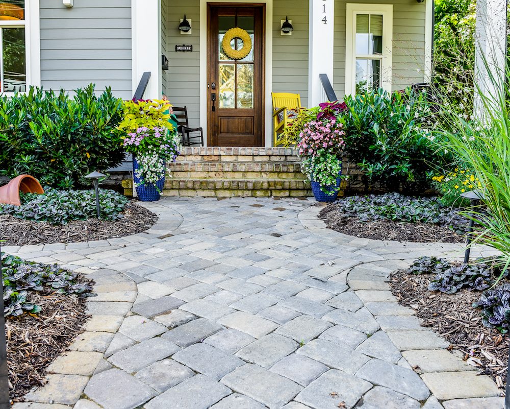 Paver Courtyard with Flower Garden | EcoGreen Landscaping